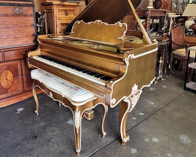 This isn't just a piano—it's a time machine with keys. The ornate details and warm wood tones speak of parlor recitals and family gatherings long past.