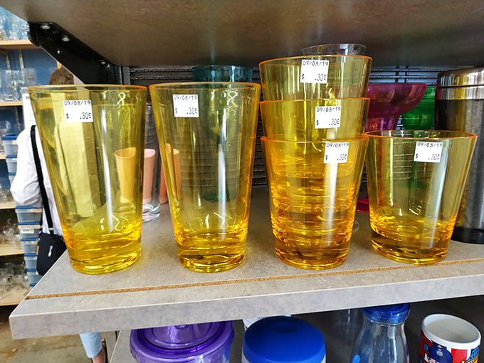 Amber glassware catching light like liquid sunshine—perfect for elevating backyard barbecues from paper cup casual to vintage chic.