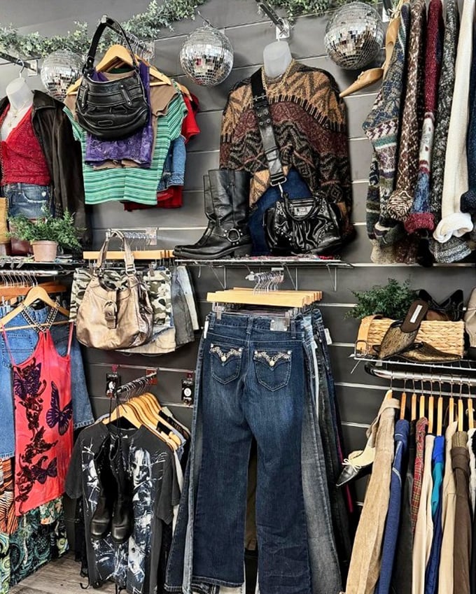 Disco balls and denim—this display wall combines vintage vibes with modern styling for the ultimate thrift store aesthetic.