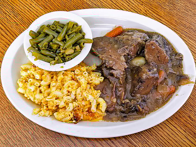 Pot roast so tender it practically surrenders at the sight of your fork, with mac and cheese that defines creamy perfection.