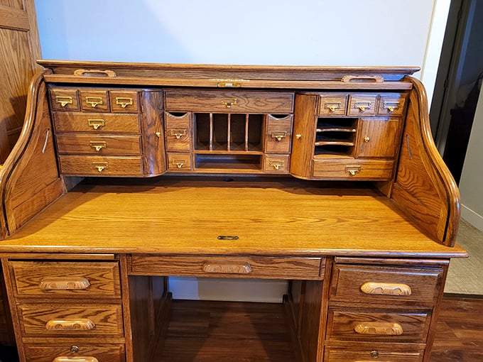 This roll-top desk has more secret compartments than a spy movie prop—perfect for hiding chocolate or unpaid bills.
