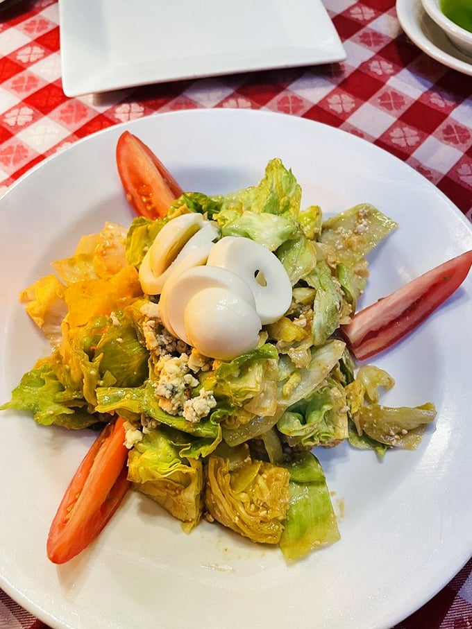 A salad that actually excites—crisp greens playing supporting roles to the real stars: perfectly boiled eggs and generous cheese crumbles.