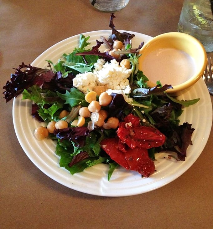 Even the salad gets special treatment here—fresh greens, chickpeas, and roasted peppers proving vegetables can hang with the big meaty players.