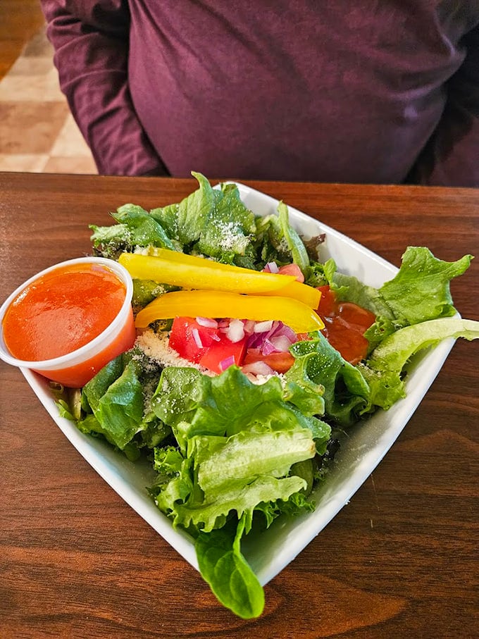 Fresh greens that didn't spend their life in plastic, vibrant vegetables, and dressing that wasn't born in a factory—a salad that makes eating healthy feel like cheating.