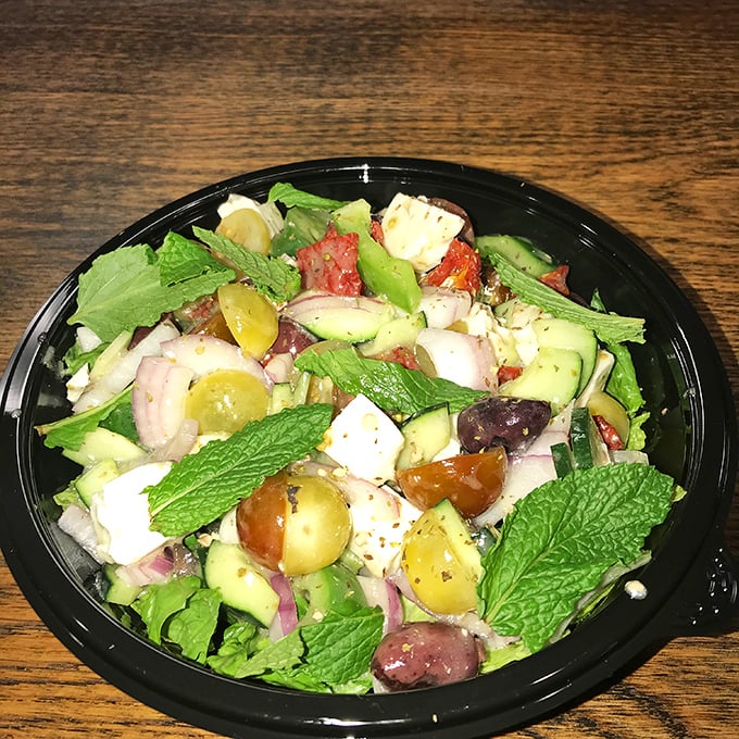 A Mediterranean salad that proves vegetables can party too—bright, fresh, and colorful enough to make you momentarily forget about the pizza.