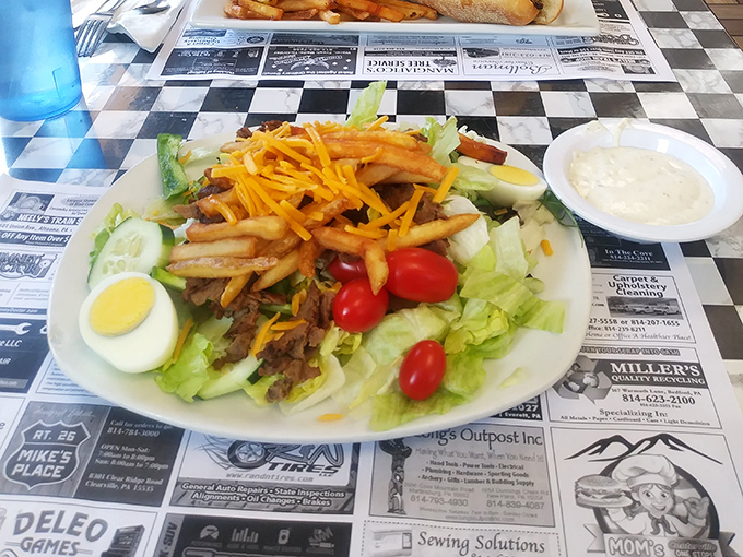 The salad-fry alliance proves that sometimes the best relationships are unexpected—crispy potatoes bringing crunch to the leafy party below.