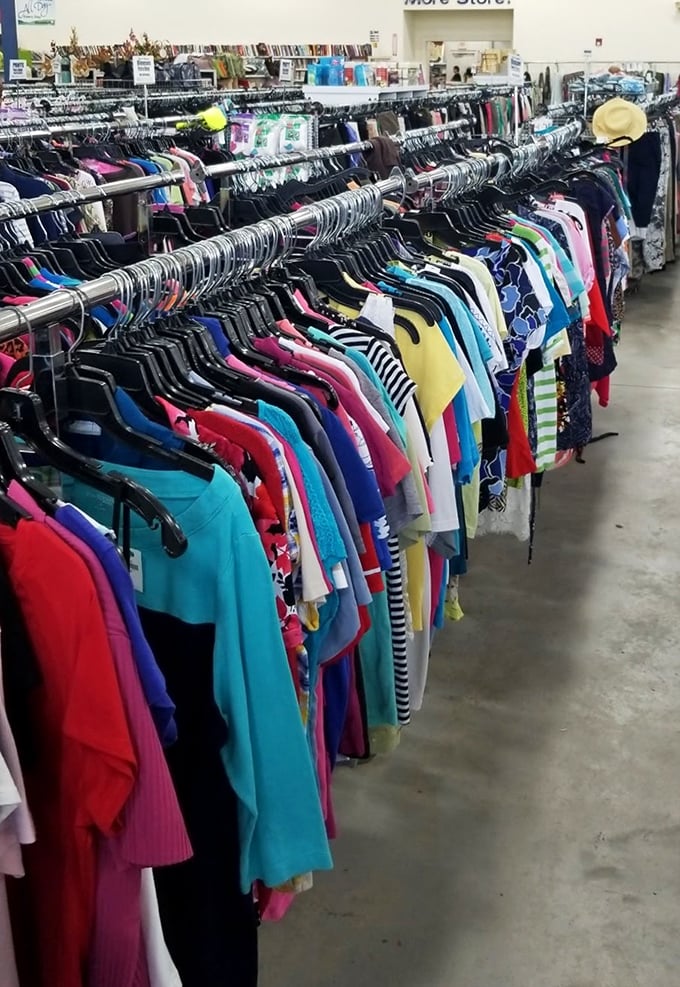 Fashion's democracy on display—where designer labels and everyday basics hang side by side in chromatic harmony.