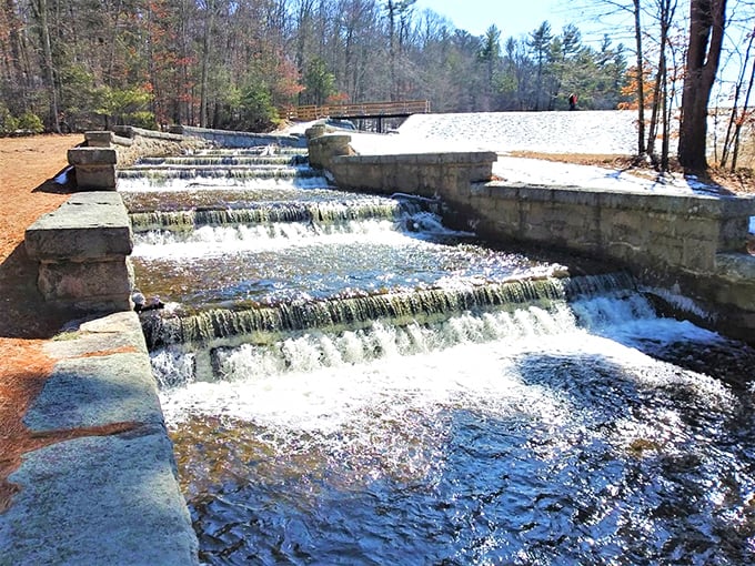 Water choreography at its finest—the spillway creates a mesmerizing cascade that sounds like nature's version of a meditation app.