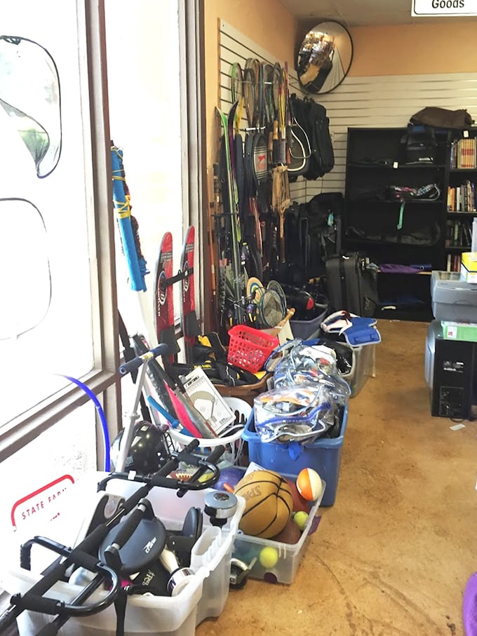 The sports equipment corner: where forgotten tennis rackets, abandoned basketballs, and barely-used exercise gear await their second chance at athletic glory.