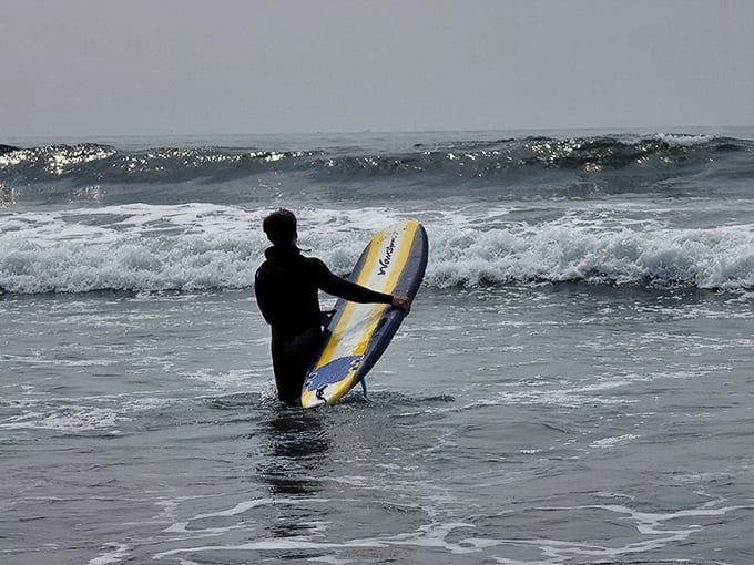The eternal optimism of surfers. No matter the temperature or conditions, they wade into the Pacific with the faith of true believers.
