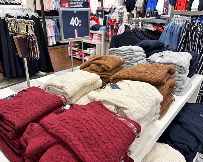 Cable-knit dreams in every color—these sweaters aren't just clothing; they're Wisconsin winter survival gear at prices that won't freeze your assets.