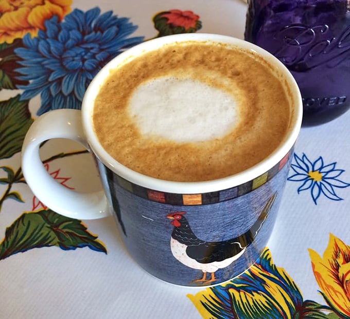 A latte that's both art and science, served in a mug that reminds you chickens deserve our respect—they make breakfast possible!