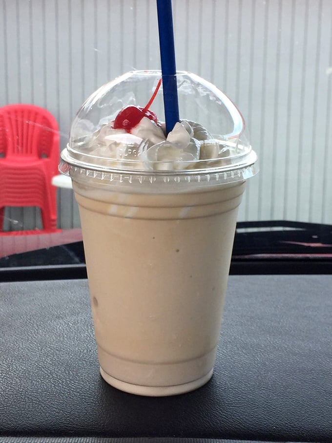 This vanilla milkshake isn't just a drink, it's a time machine to simpler days—topped with whipped cream and a cherry for proper nostalgic effect.