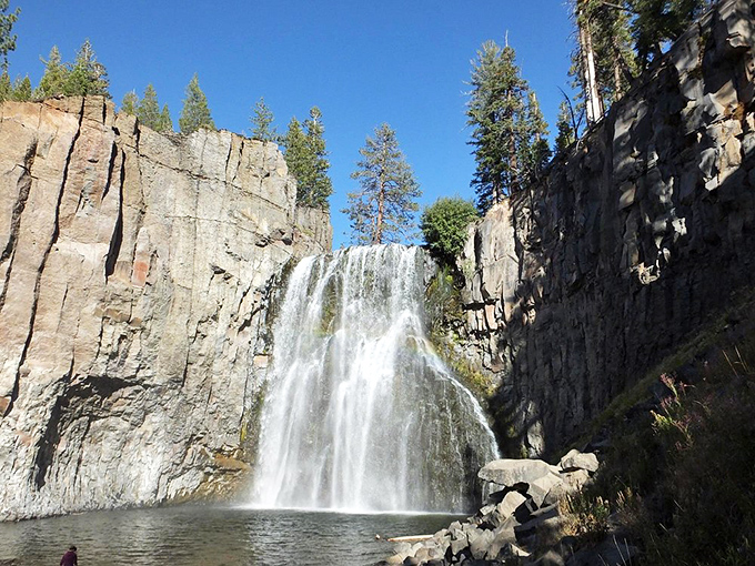 The falls frame themselves between volcanic walls like they're posing for their own album cover – "Greatest Hits of the Sierra Nevada."