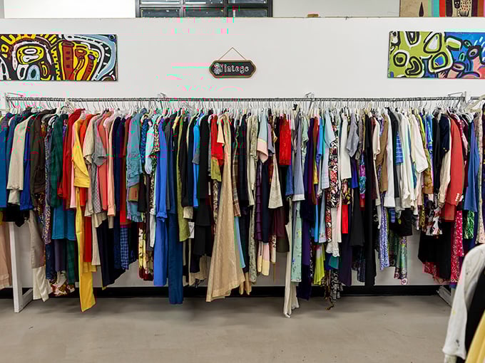 The vintage clothing rack—where fashion decades collide in a rainbow of possibilities. Yesterday's trends waiting for tomorrow's style maverick.