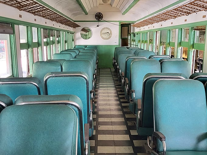 Step inside this vintage passenger car with its mint-green interior and teal seats, and you're transported to an era when travel was an elegant affair.