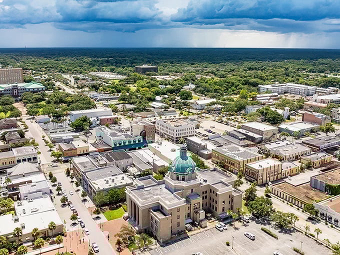 Downtown Deltona shines under dramatic Florida skies, where culture blend perfectly for retirees seeking the good life.