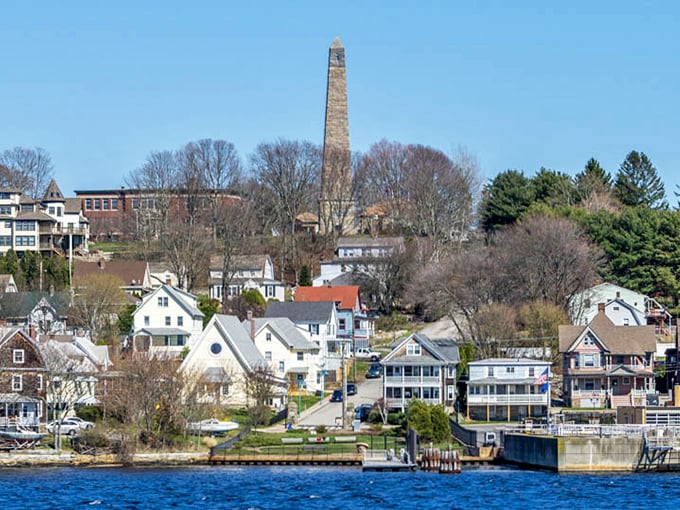 Houses climb the hillside overlooking the Thames, where submarine base neighbors live the coastal life without Mystic's tourist prices.