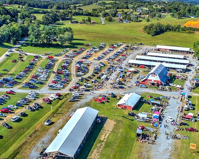 Jonesborough Flea Market's iconic red barn stands proudly among rolling hills – a beacon for bargain hunters across Tennessee.