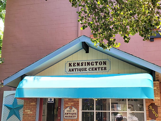 Kensington's turquoise awning pops against pink walls – a colorful invitation to explore decades of design and nostalgia.