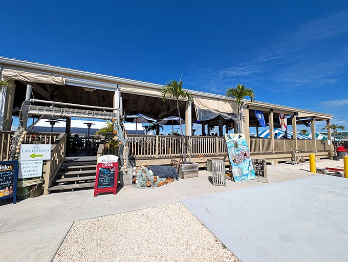 The simple wooden deck and casual vibe at Key Largo Fisheries Backyard Cafe scream "vacation mode activated"—where seafood tastes better with your toes practically in the water.