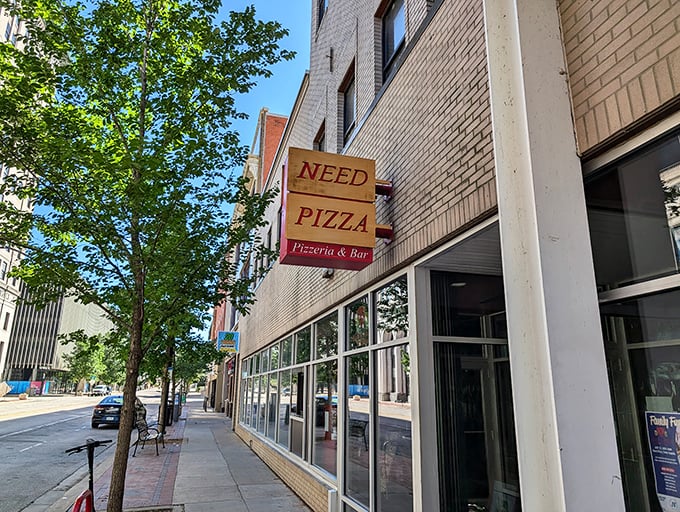 "NEED PIZZA" – now that's truth in advertising! This downtown spot understands our most basic cravings.