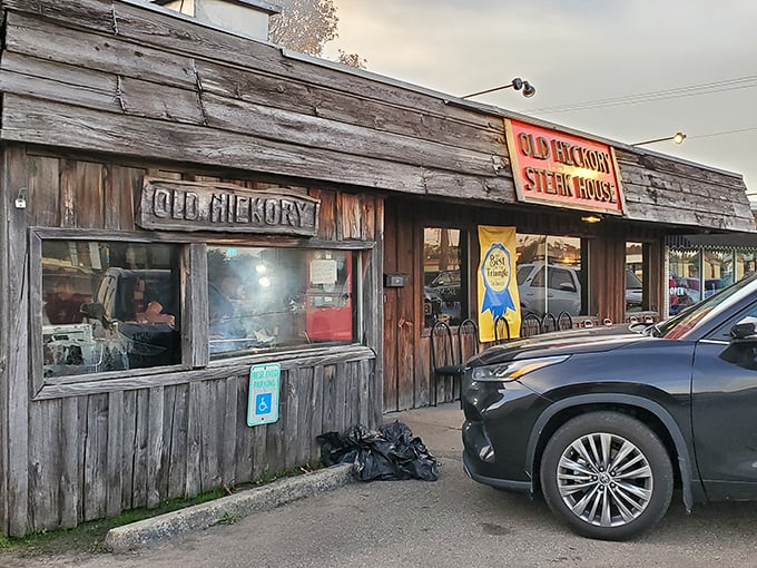 Old Hickory's weathered wood exterior screams authentic steakhouse from a bygone era.