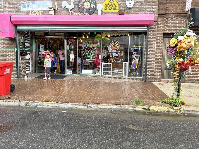 Philly AIDS Thrift's vibrant pink storefront and artistic murals celebrate both style and social consciousness beautifully.