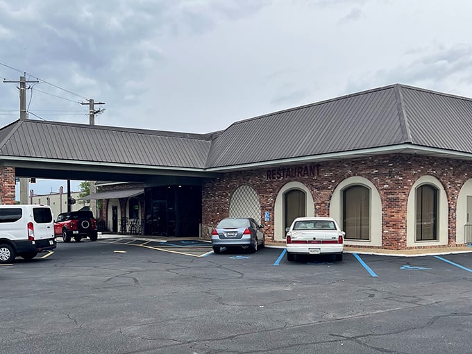 The Plaza Restaurant: "That stone sign doesn't lie—this place is indeed a plaza of flavors. Classic architecture housing both surf and turf treasures."