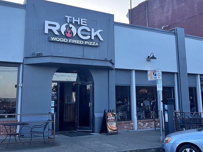 Industrial chic meets artisan craft, where wood-fired ovens transform simple ingredients into smoky pizza perfection.