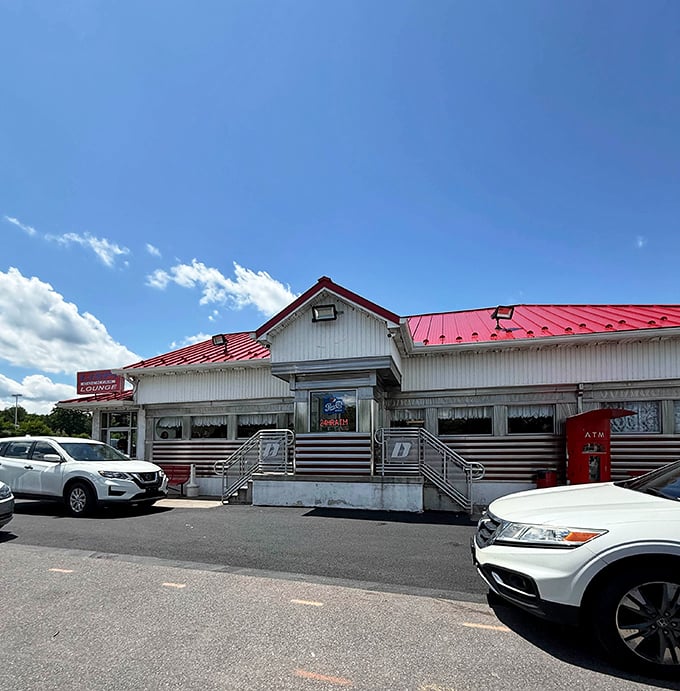 The classic silver-and-red exterior of D's Diner has that timeless quality—like it's been serving comfort food since before your parents went on their first date.