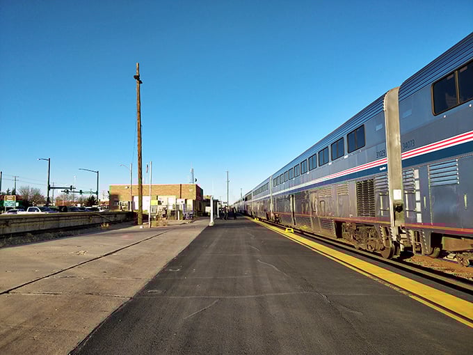 Travelers arrive in La Junta as sunlight warms the platform, capturing the timeless beauty of train journeys through Colorado’s plains.