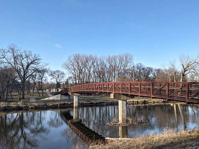 This peaceful bridge in Mason City connects more than just riverbanks – it links affordable living with quality of life.