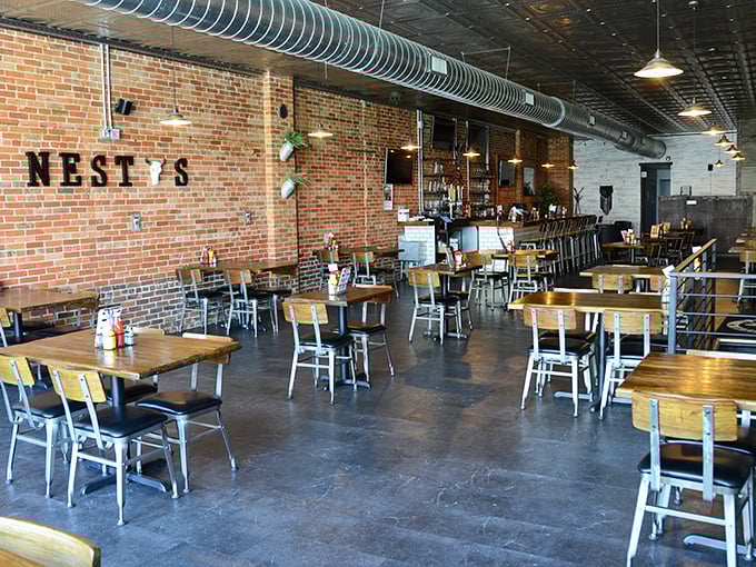 Inside Nesty's, exposed brick and industrial chic create the perfect backdrop for burger perfection. Comfort food in a cool setting!