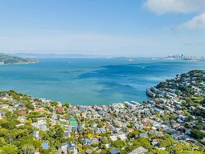 The San Francisco skyline plays peekaboo across the bay from Sausalito. City lights without city prices—the best of both worlds.