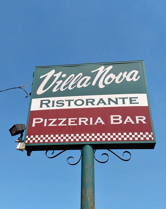 That classic tricolor sign is the Italian equivalent of "good food this way"—and it never disappoints.