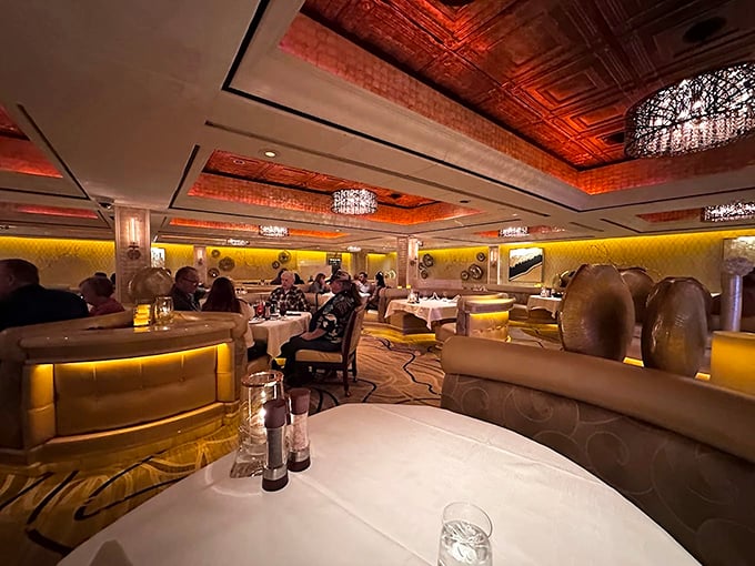 Rich textures and warm lighting create the perfect steakhouse atmosphere - elegance doesn't need to shout.