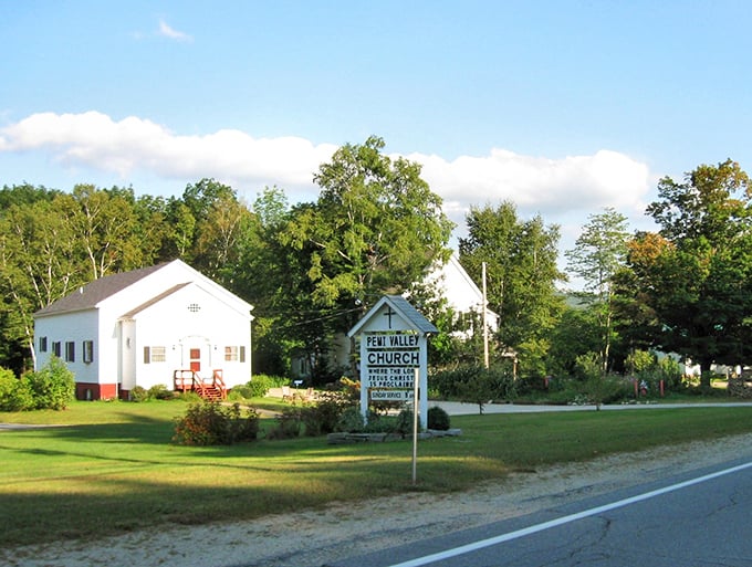 Main Street Woodstock – where small-town New Hampshire shows its white church nestled on the side that seem plucked from a more peaceful era.