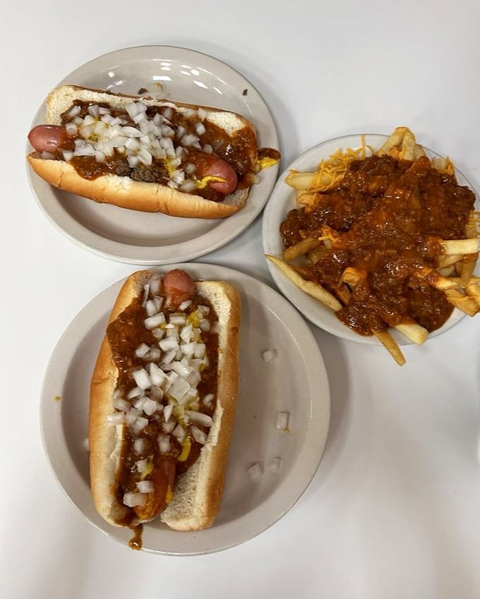 The holy trinity of Detroit dining: two perfect coney dogs and chili fries. Name a more iconic trio—I'll wait.