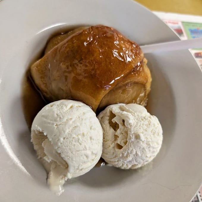 The apple dumpling arrives warm, ice cream melting into rivers of vanilla—a dessert so good it deserves its own theme song.