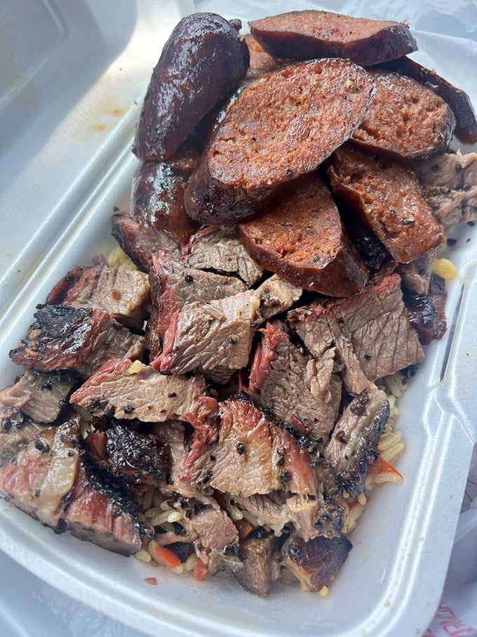 A BBQ bowl that's basically meat Tetris—perfectly arranged brisket, sausage, and sides creating a game where everybody wins, especially your taste buds.