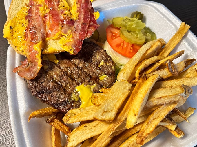 The bacon cheeseburger arrives like a celebrity – commanding attention, making promises it absolutely keeps, and leaving you wanting more.
