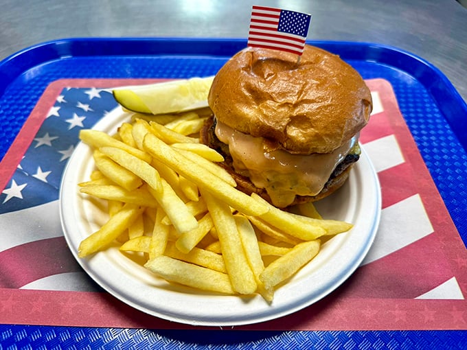This burger, crowned with an American flag, isn't just patriotic – it's a testament to Kay's versatility. The melty cheese cascades like delicious lava down the patty.