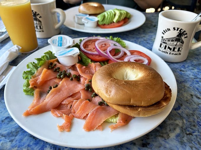 The salmon bagel plate – proof that sometimes the simplest combination of smoke, salt, and carbs can create a breakfast masterpiece worthy of worship.
