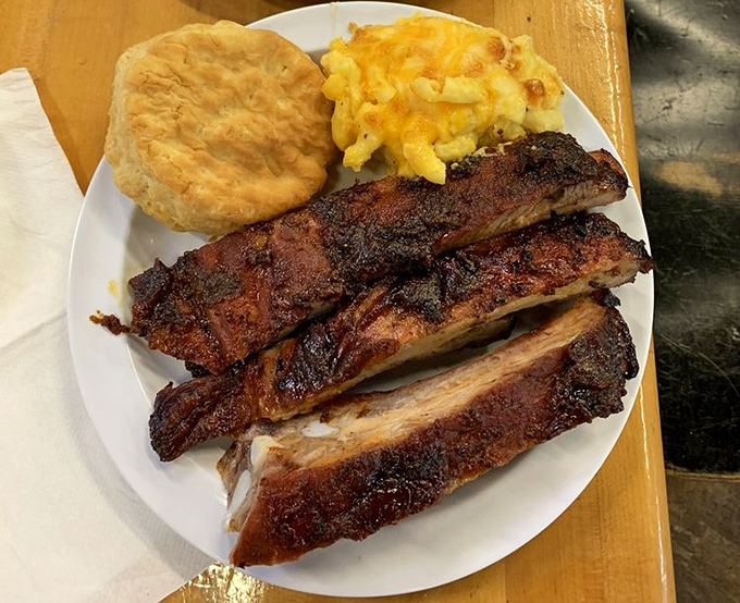 These ribs don't just fall off the bone—they practically leap onto your fork, bringing mac and cheese and a perfect biscuit along for the ride.
