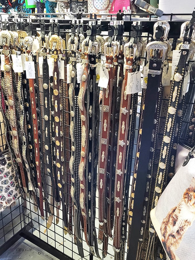 Western-style belts with ornate buckles hang like trophies, waiting for the perfect pair of jeans to complete their story.