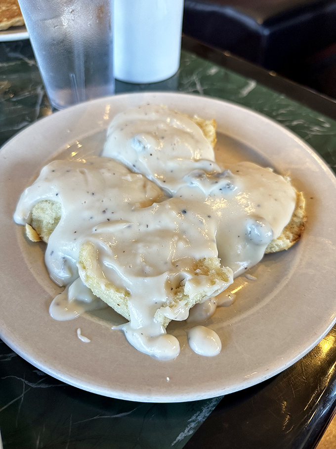 Biscuits swimming in creamy pepper gravy—a Southern tradition that's worth every single delicious calorie and food coma that follows.