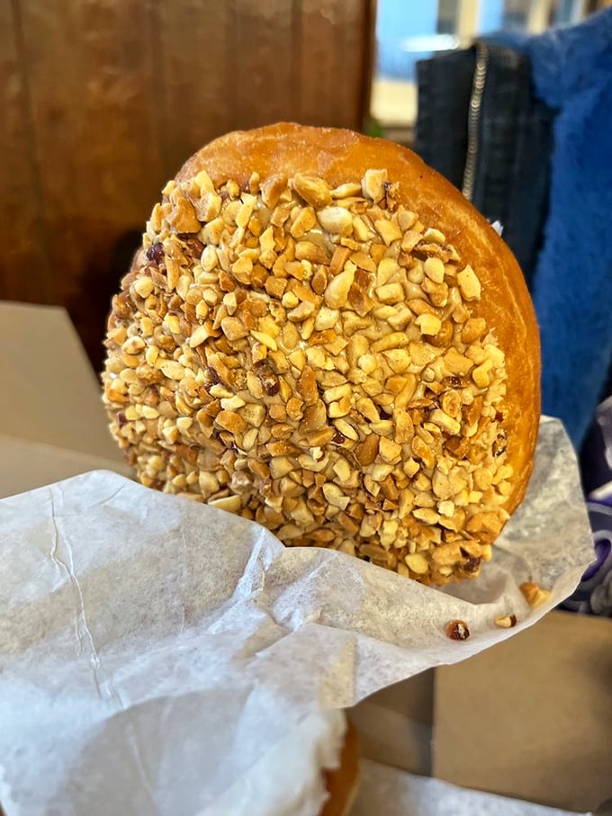 This isn’t just a donut—it’s a golden-brown bismarck donut, a time machine that transports you back to childhood with one perfectly glazed bite.