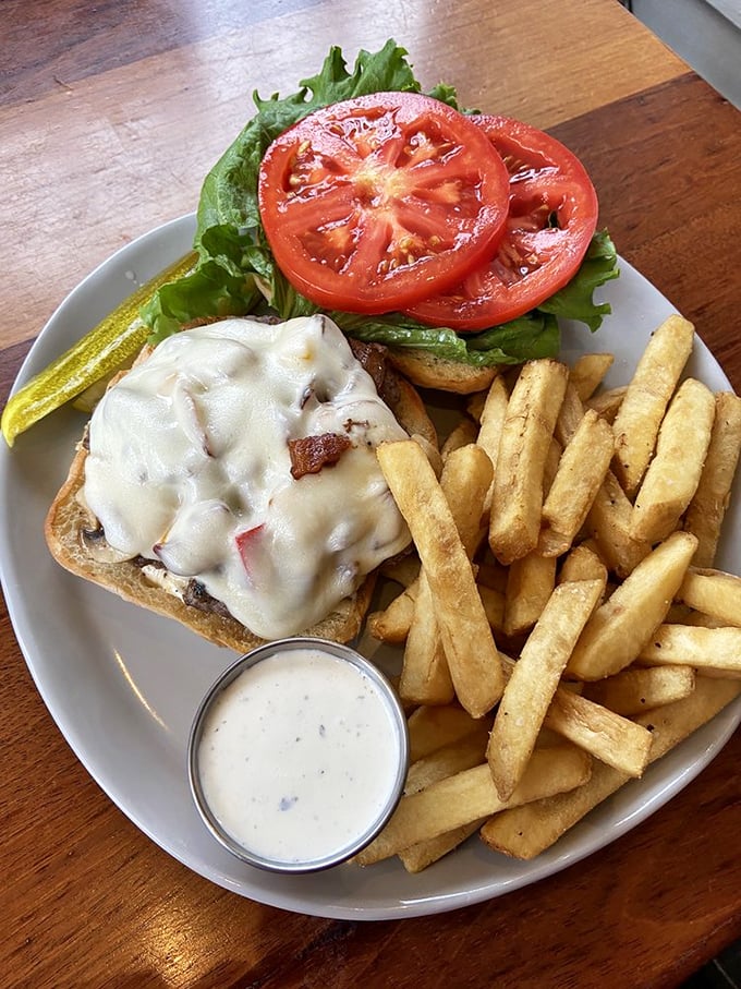 This burger and fries combo isn't just lunch—it's edible architecture, with melted cheese as the structural support.