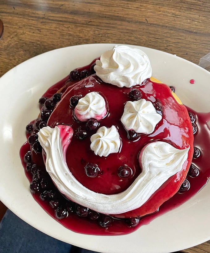 This isn't just a pancake—it's a berry-topped masterpiece with whipped cream islands. Breakfast that doubles as modern art, but tastes infinitely better.